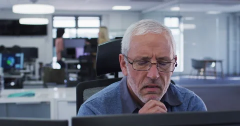 Thoughtful man looking at his computer s... | Stock Video | Pond5
