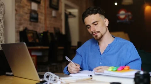 thoughtful man thinking writing notes in... | Stock Video | Pond5
