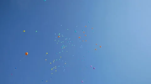 Thousands of colorful balloons are launc... | Stock Video | Pond5