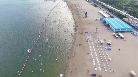 Thousands hit the beach as heatwave bake... | Stock Video | Pond5