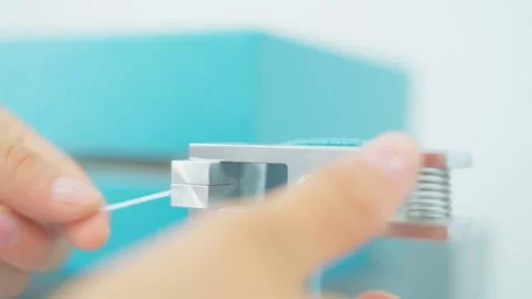 Thread for plastic sack bags is installe... | Stock Video | Pond5