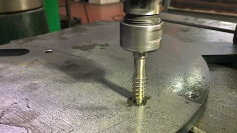 Threading in the hole of the iron billet... | Stock Video | Pond5