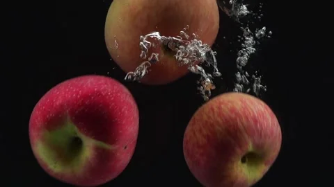 Three Apples Falling Into Water On The B... | Stock Video | Pond5