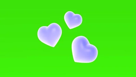 Three blue powder hearts move on a green... | Stock Video | Pond5