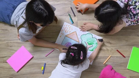 Three children is drawing the picture in... | Stock Video | Pond5