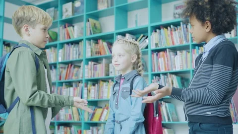 Three diverse students talking in school... | Stock Video | Pond5