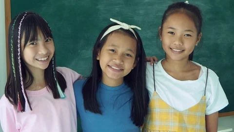 Three girl smiling in school classroom | Stock Video | Pond5