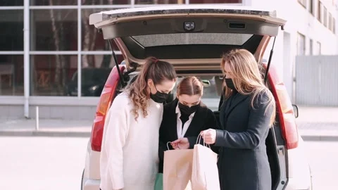 Three girls in masks are looking at shop... | Stock Video | Pond5
