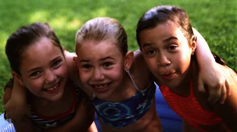 Three girls standing arm in arm before f... | Stock Video | Pond5