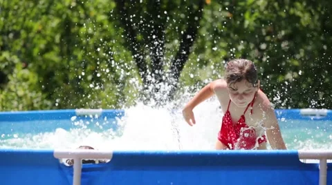 Three happy children splash in swimming ... | Stock Video | Pond5