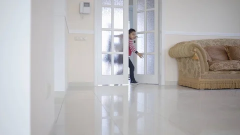 Three happy kids open the door and run i... | Stock Video | Pond5