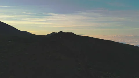 Three hikers climbing on a cliff below t... | Stock Video | Pond5