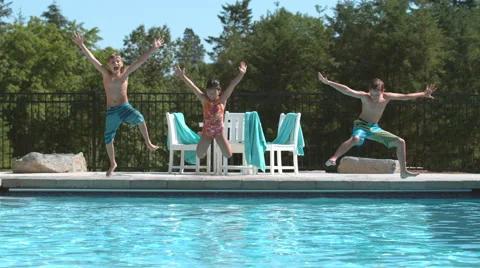 Three kids jumping into pool in super sl... | Stock Video | Pond5