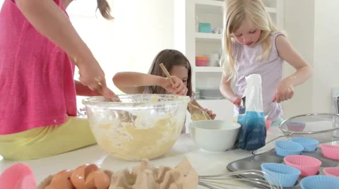 Three Little Girls Making Cake Together | Stock Video | Pond5