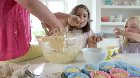 Three Little Girls Making Cake Together | Stock Video | Pond5