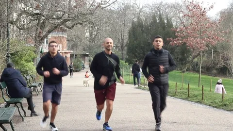 Three men running together in Buttes-Cha... | Stock Video | Pond5