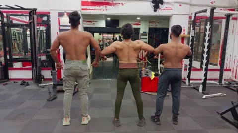 Three muscular men showing off their bac... | Stock Video | Pond5