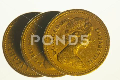 Three one pound coins Three one pound coins on the white background ...
