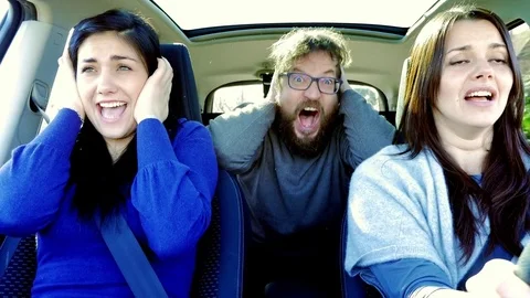 Three people screaming in car getting in... | Stock Video | Pond5
