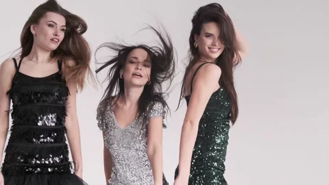 Three preety girls is dancing in the bla... | Stock Video | Pond5