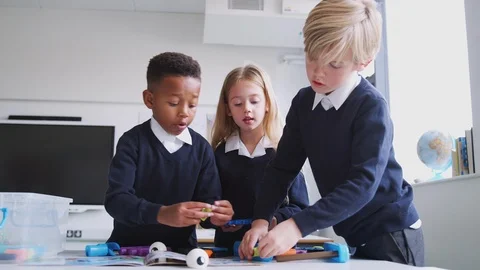 Three primary school children working wi... | Stock Video | Pond5