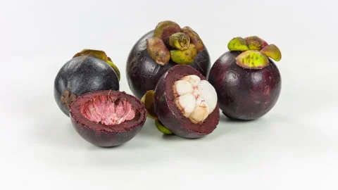 Three whole fruits and one half isolated... | Stock Video | Pond5