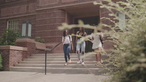 Three Women Walking Out of a Building | Stock Video | Pond5