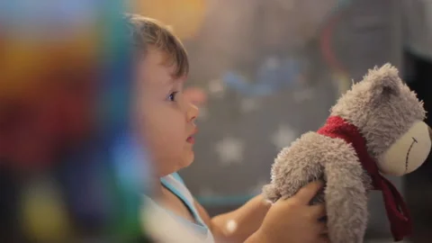 Three Year Old Boy With Teddy Bear Watch... | Stock Video | Pond5