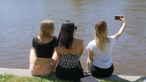 Three young girls friends back view sit ... | Stock Video | Pond5