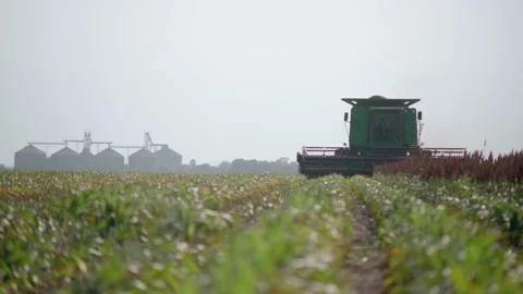 Threshing machine working a farm field, ... | Stock Video | Pond5