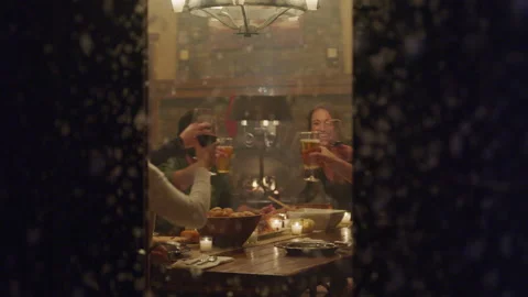 Through Lit up Window Friends Make Toast... | Stock Video | Pond5