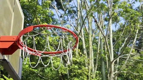 Throw in a basketball hoop at park with ... | Stock Video | Pond5