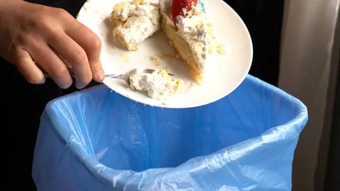 Throwing Cake in the trash bin. Food Was... | Stock Video | Pond5