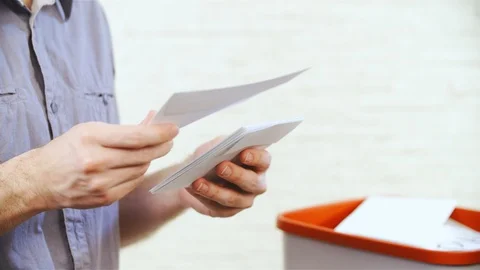 Throwing mail into trashcan in slow moti... | Stock Video | Pond5