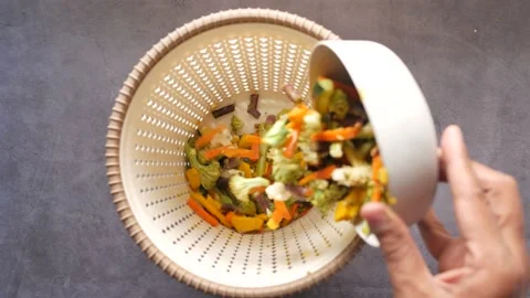 throwing vegetables in a garbage bin | Stock Video | Pond5