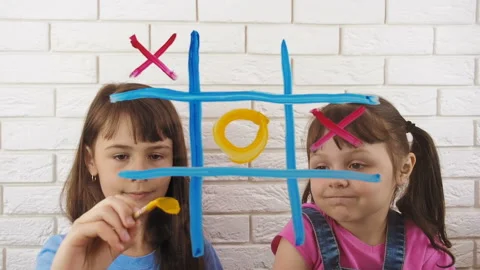 Tic-tac-toe. Children draw with colors. | Stock Video | Pond5