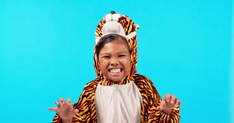 Tiger costume, roar and face of girl in ... | Stock Video | Pond5