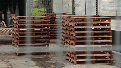 tight shot, piles of wood palettes skids... | Stock Video | Pond5