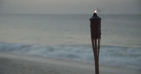 Tiki Torch on Beach at Sunset, Cinematic... | Stock Video | Pond5