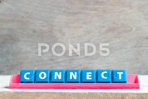 Photograph: Tile alphabet letter with word connect in red color rack on ...