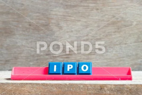 Photograph: Tile letter on red rack in word IPO (Abbreviation of ...