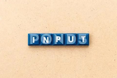 Tile letter in word input on wood background Stock Image #115257546