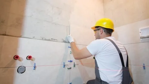 Tile maker performs the work of laying t... | Stock Video | Pond5