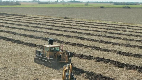 Tile plow trench digger digging drainage... | Stock Video | Pond5