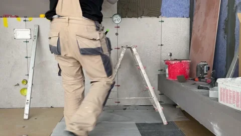 Tiling work. View of the finished wall a... | Stock Video | Pond5