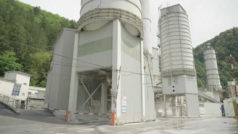 Tilt up of dirty factory silo 4K | Stock Video | Pond5