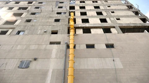 Tilt down footage of a building with yel... | Stock Video | Pond5