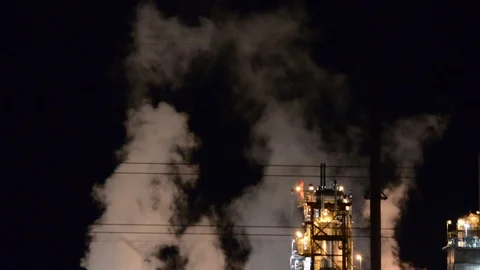 Tilt Down - Oil Refinery at Night - Smok... | Stock Video | Pond5