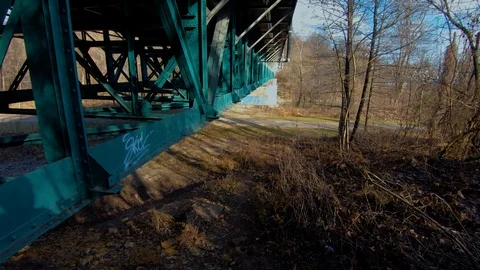 Tilt down under iron road bridge steel f... | Stock Video | Pond5