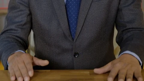 Tilt up to an Indian business man raisin... | Stock Video | Pond5